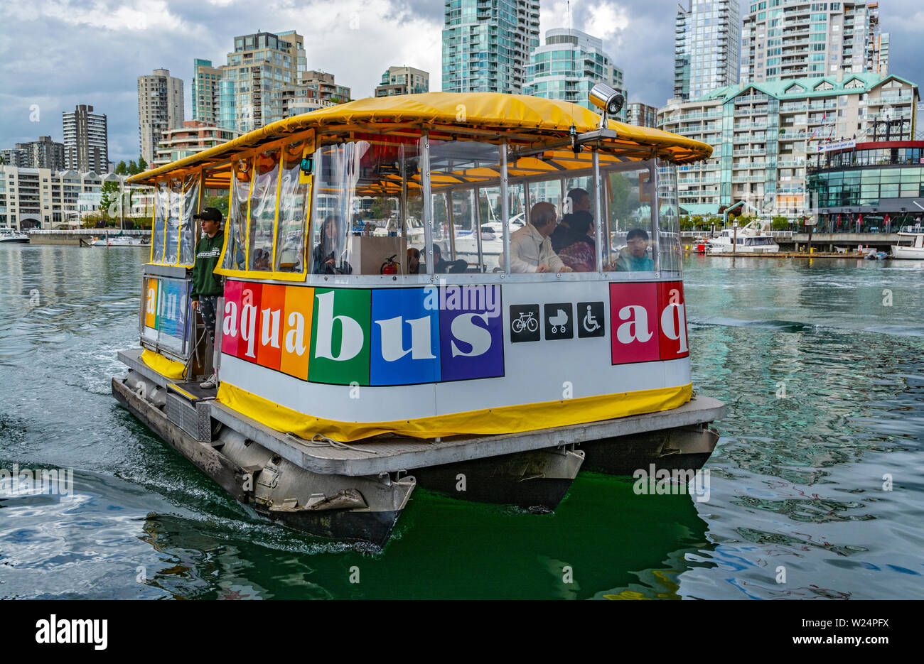 Canada, British Columbia, Vancouver, False Creek, Aquabus approaching ...