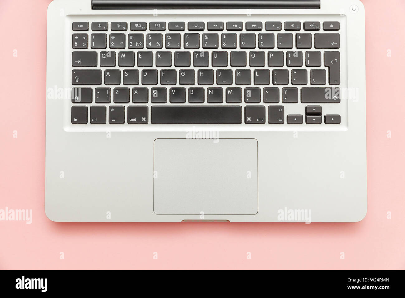 Keyboard laptop computer isolated on pink pastel desk background ...
