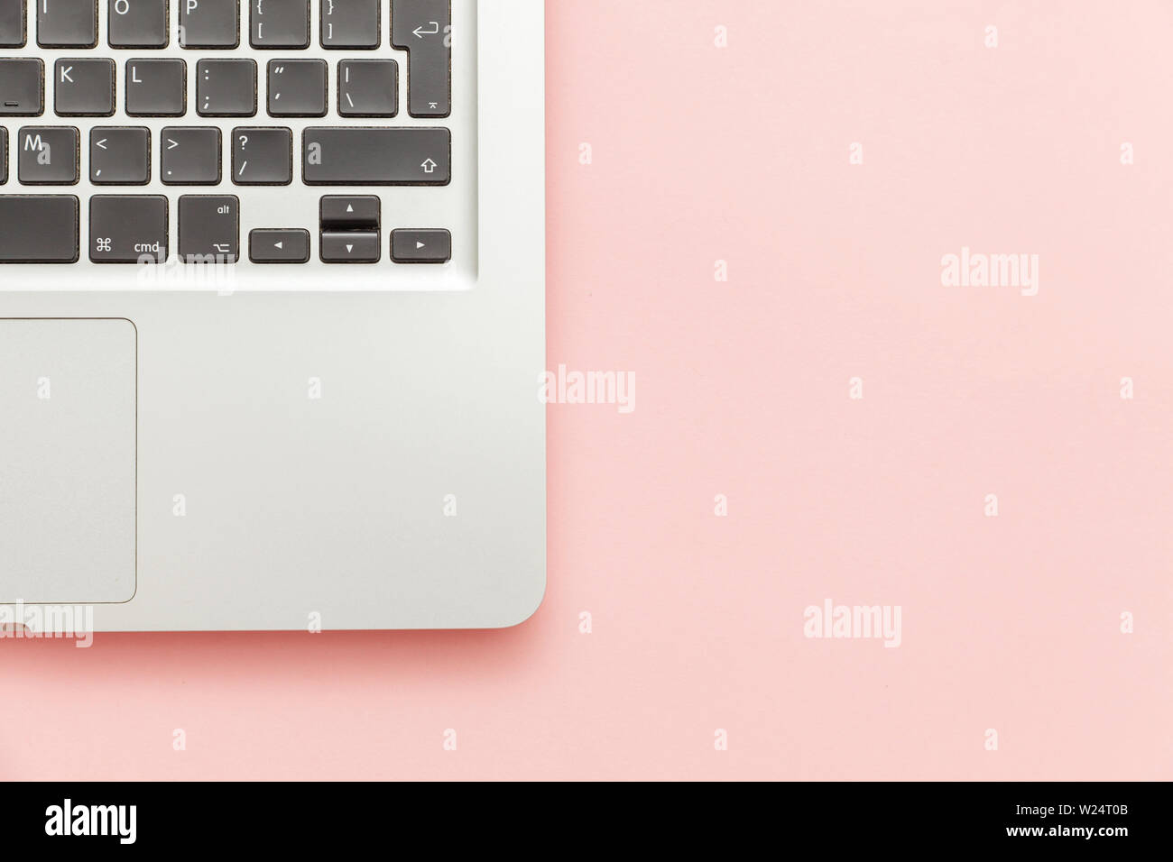 Keyboard laptop computer isolated on pink pastel desk background ...