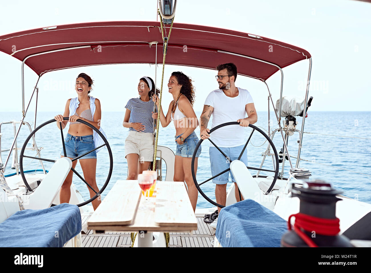 Happy young friends sailing in a sea on the yacht Stock Photo - Alamy