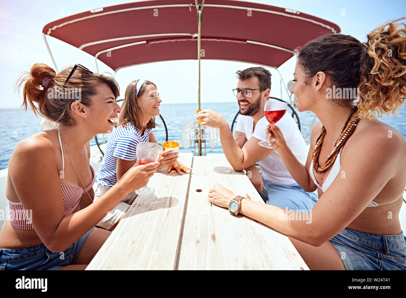Happy friends on sailing hi-res stock photography and images - Alamy