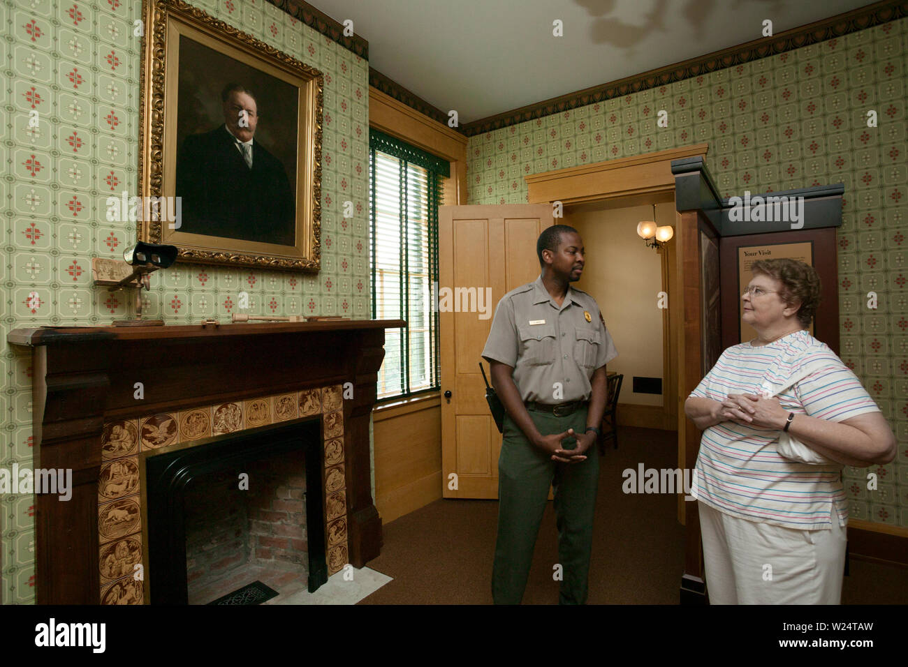 An African American park ranger takes a visitor on a tour of the Taft ...