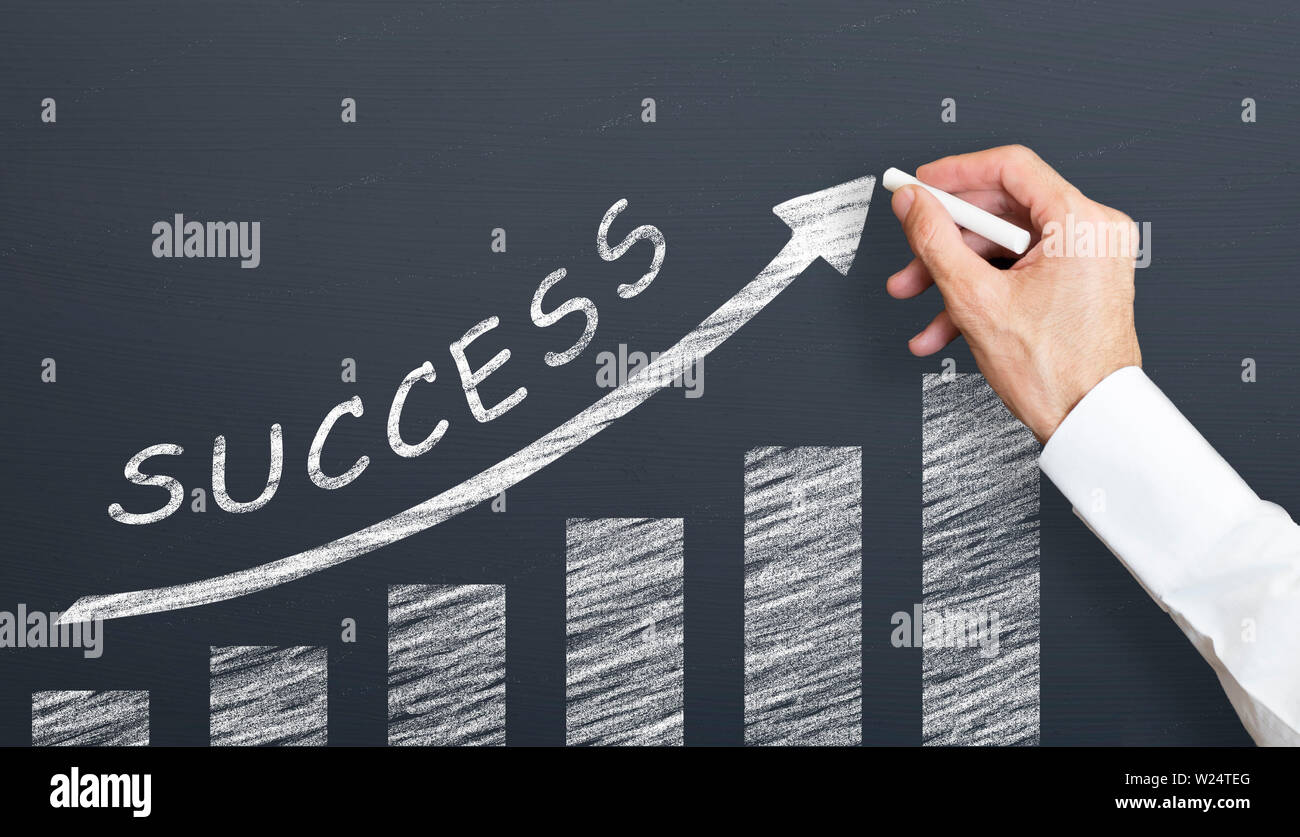 man is drawing success graph on chalkboard. success concept Stock Photo ...