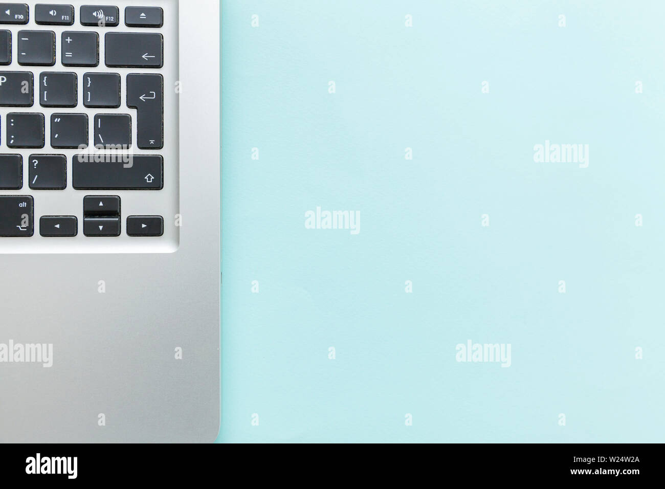 Keyboard laptop computer isolated on blue pastel desk background ...