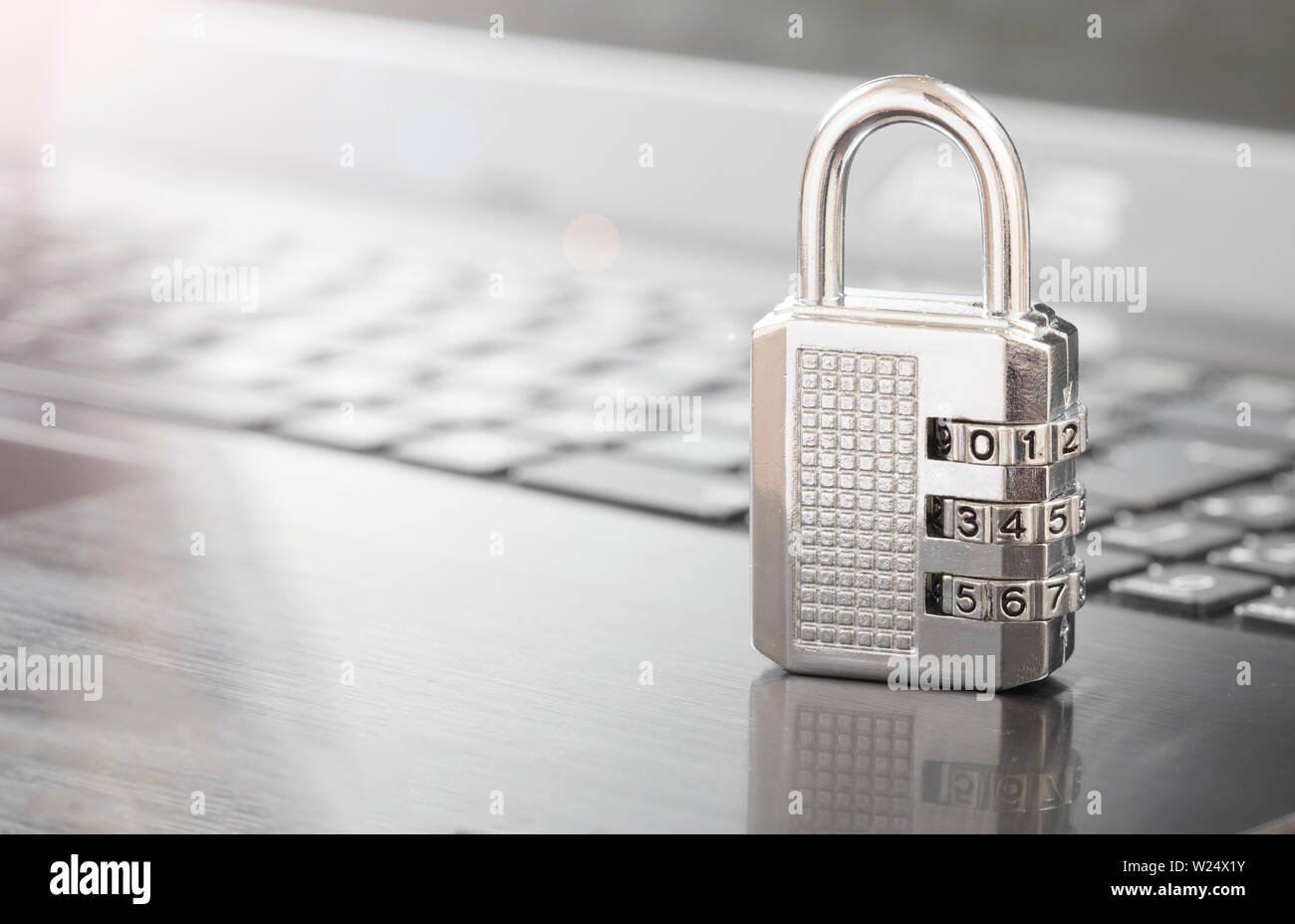 silver combination lock on keyboard.cyber security concept Stock Photo ...