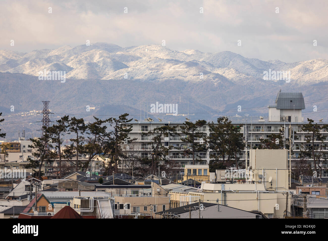 Snow covered mountains create beautiful winter landscape behind ...
