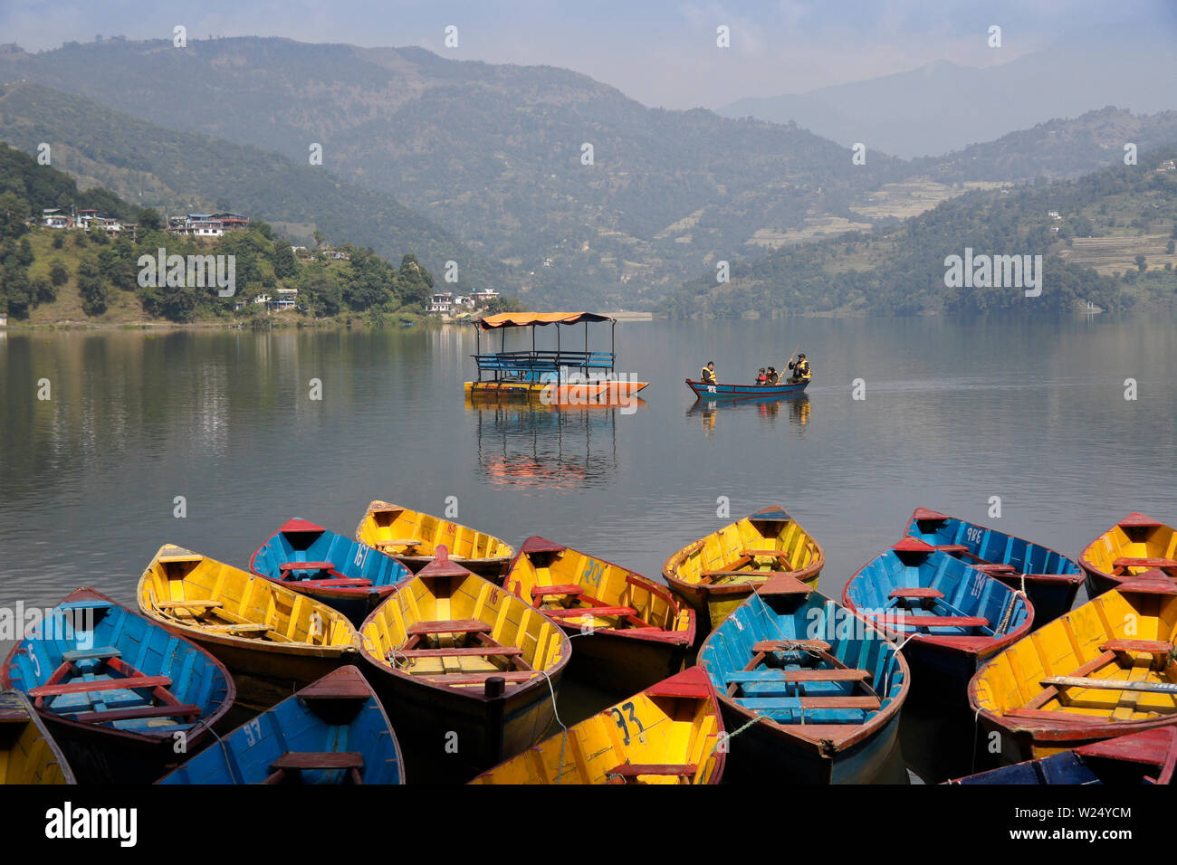 Colorful wood tourist boats on Begnas Tal (Begnas Lake) near Pokhara ...