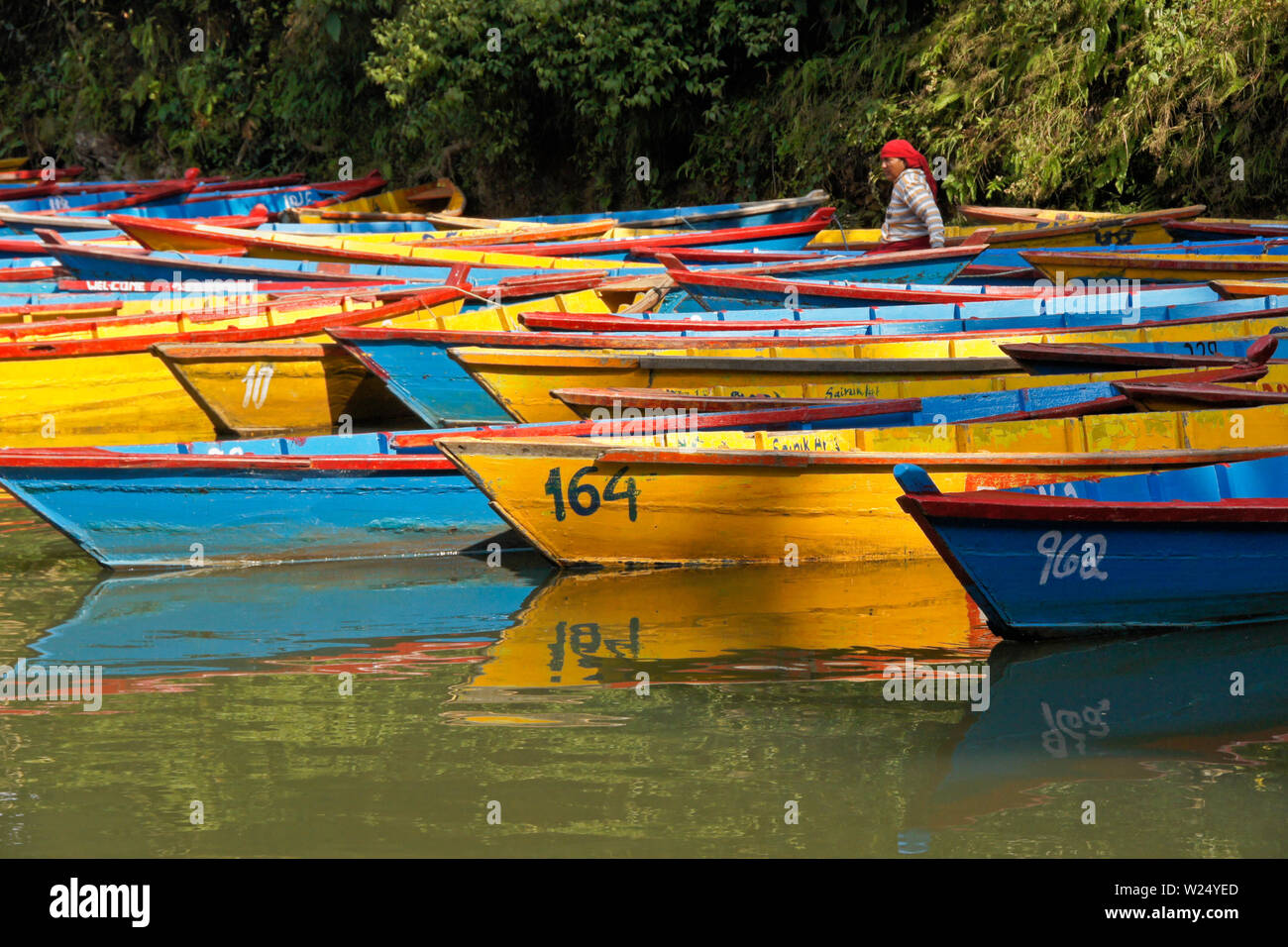 Colorful wood tourist boats on Begnas Tal (Begnas Lake) near Pokhara ...