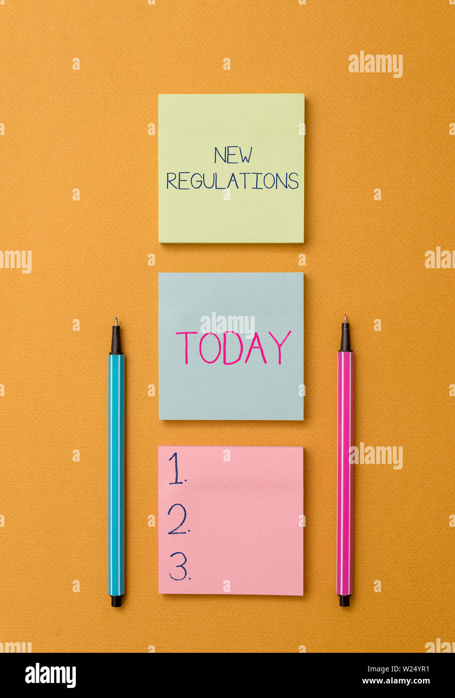 Writing note showing New Regulations. Business concept for Regulation ...