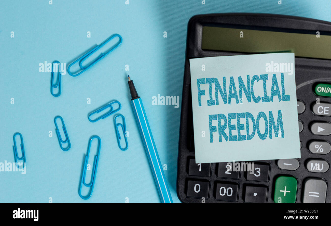 Writing note showing Financial Freedom. Business concept for Having ...