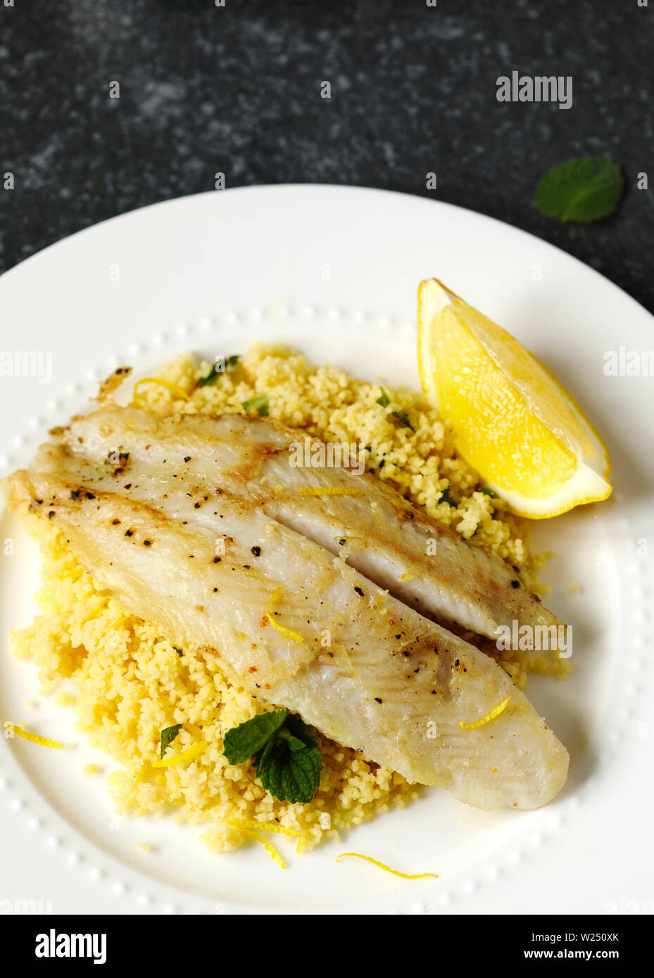 Fried Basa Fillet with Lemon Couscous Stock Photo - Alamy