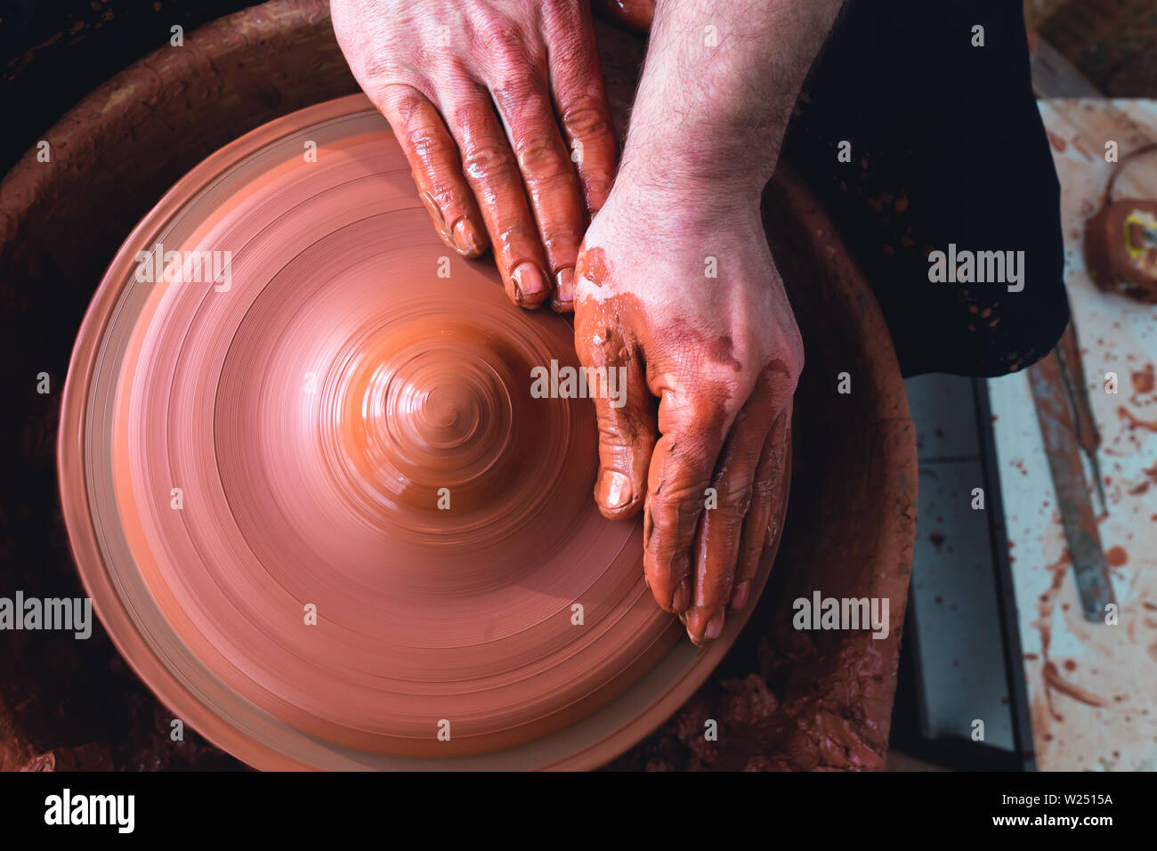 Professional potter making bowl in pottery workshop, studio Stock Photo ...