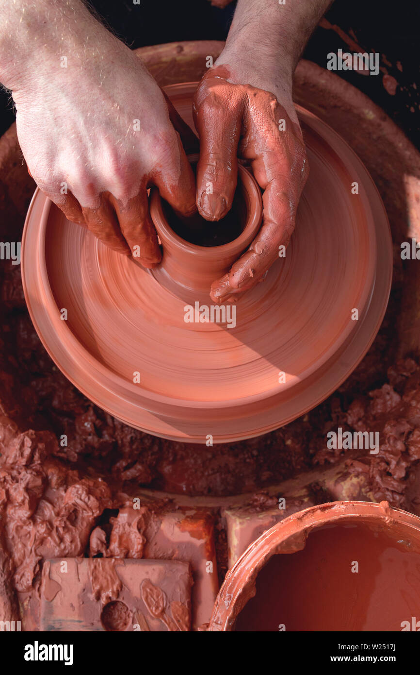 Professional potter making bowl in pottery workshop, studio Stock Photo ...
