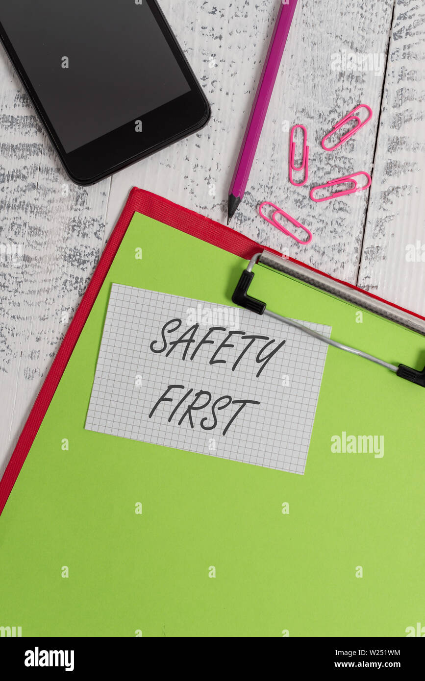 Handwriting text writing Safety First. Conceptual photo used to say ...