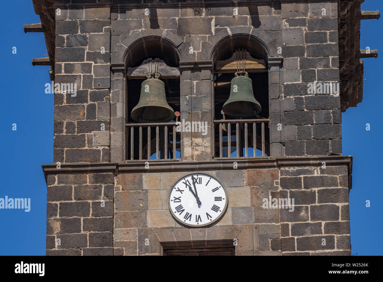 Bell tower with big clock on the wall in Church of the Immaculate ...