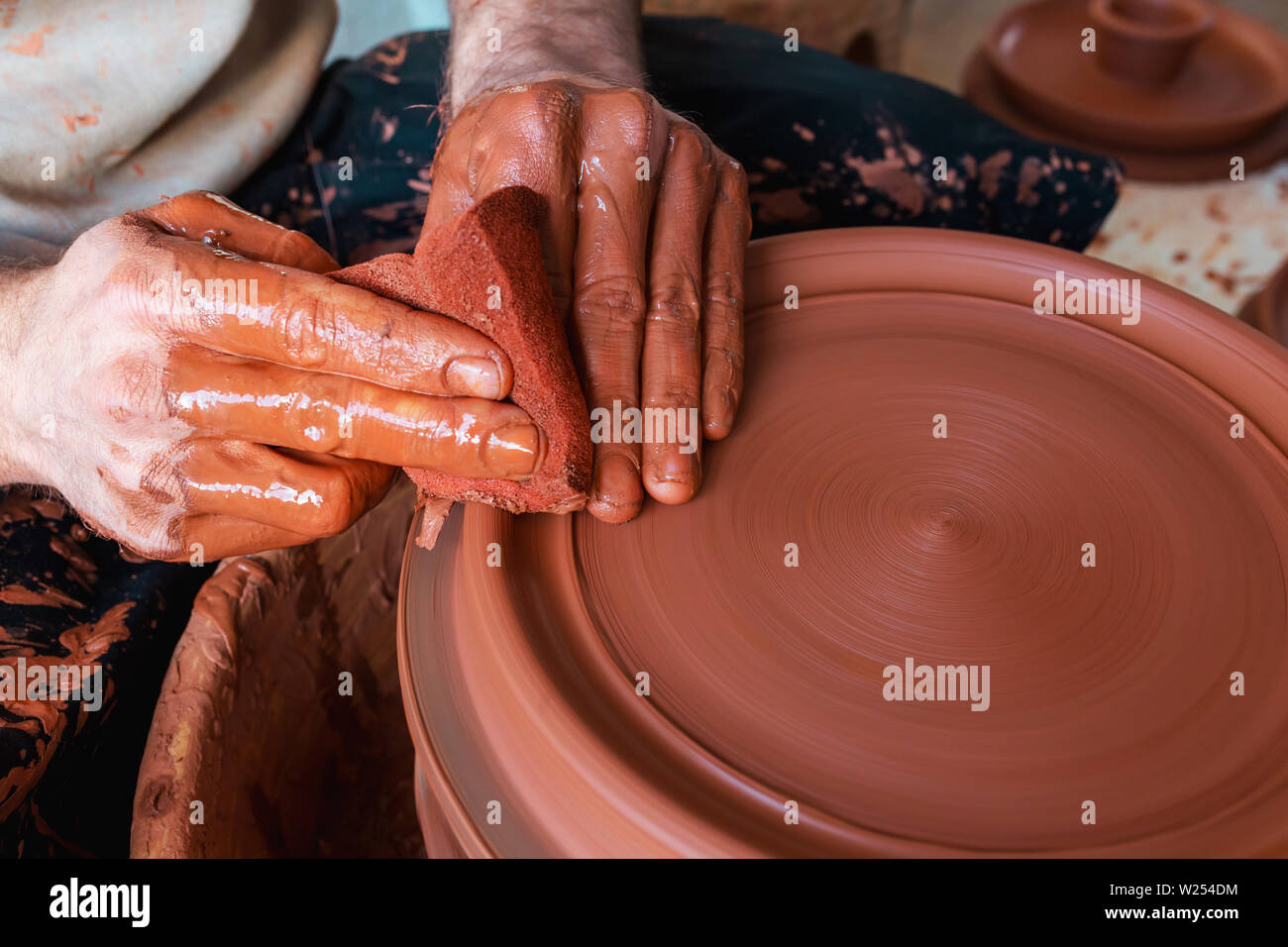 Professional potter making bowl in pottery workshop, studio Stock Photo ...