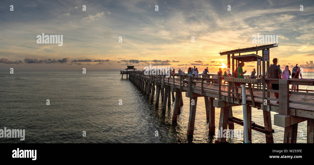 Sunset at the Naples Pier on Naples Beach in Naples, Florida Stock ...