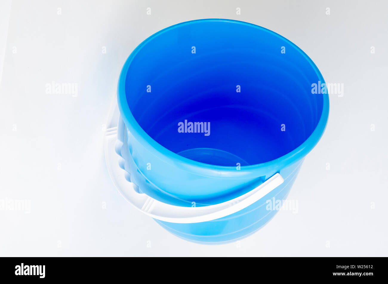 Bucket new blue empty isolated on white background Stock Photo - Alamy