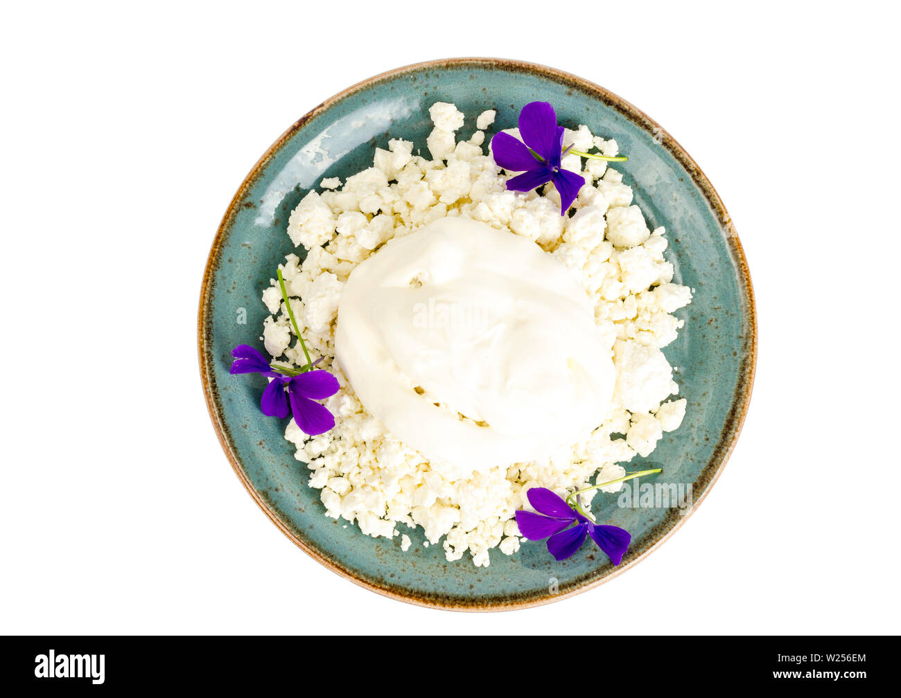 Blue plate with granulated cottage cheese Stock Photo - Alamy