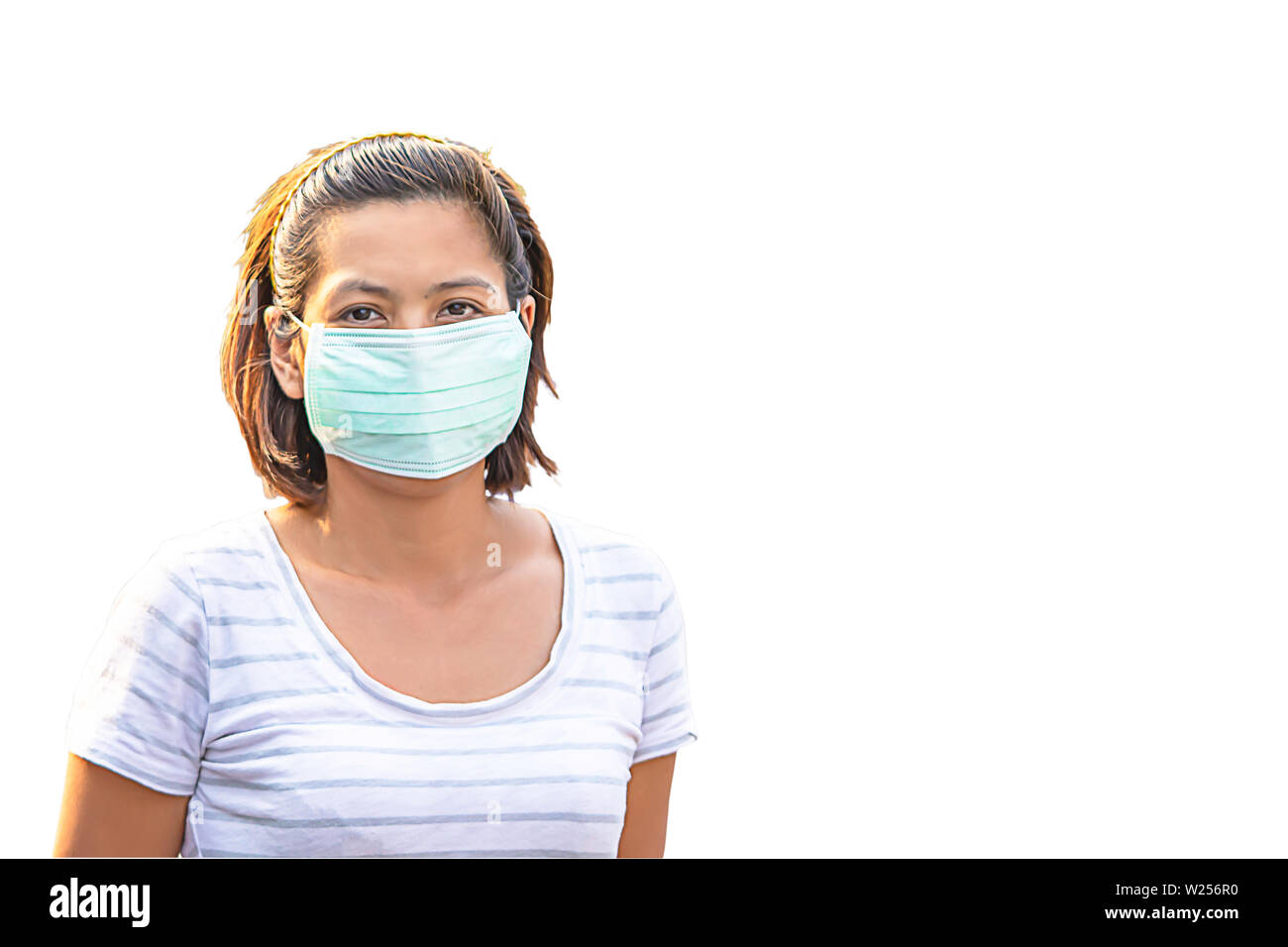 Isolated Asean Woman wear a mask to prevent dust on a white background ...
