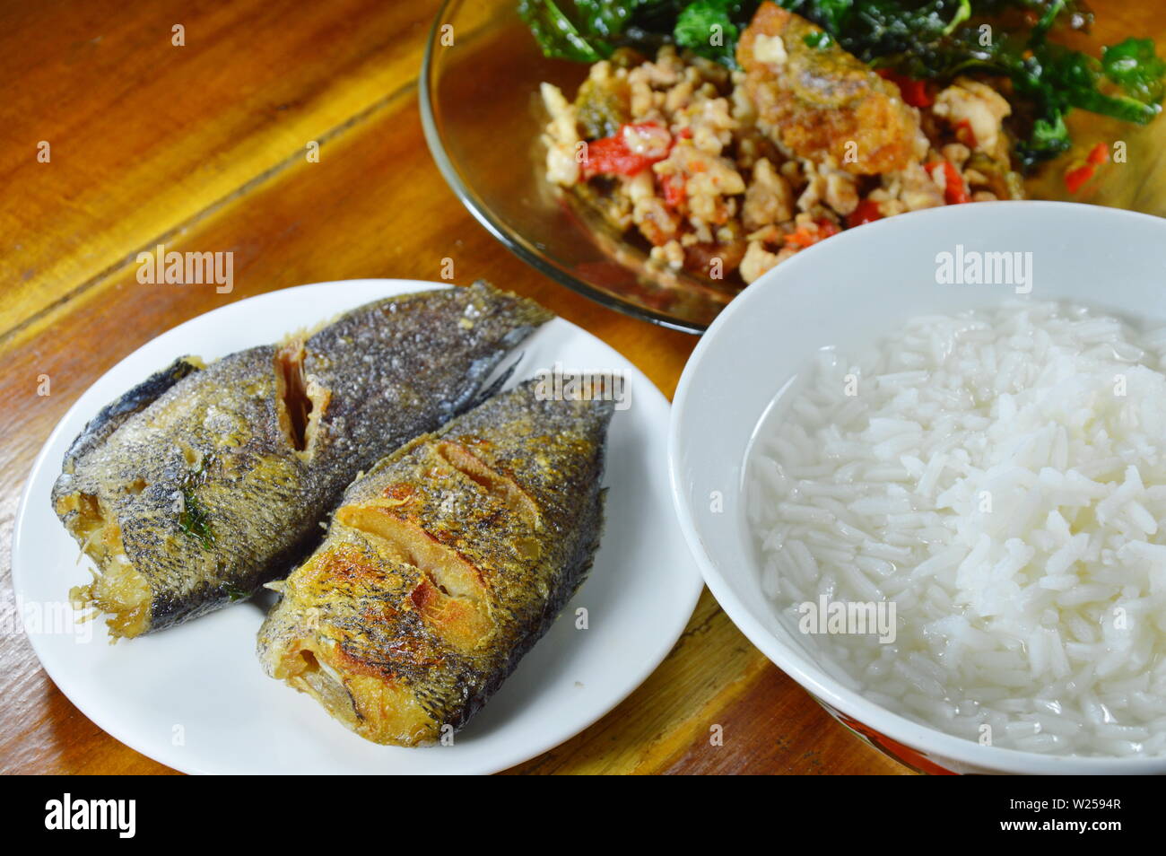 rice porridge eat with stir fried crispy basil leaf with black ...