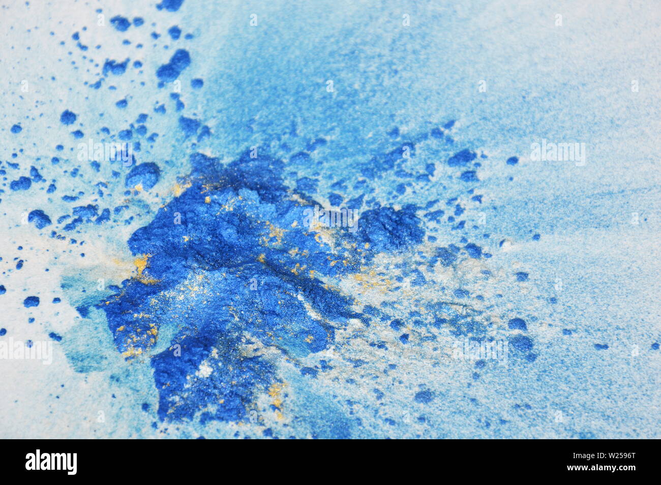 color powder spread on white paper Stock Photo - Alamy