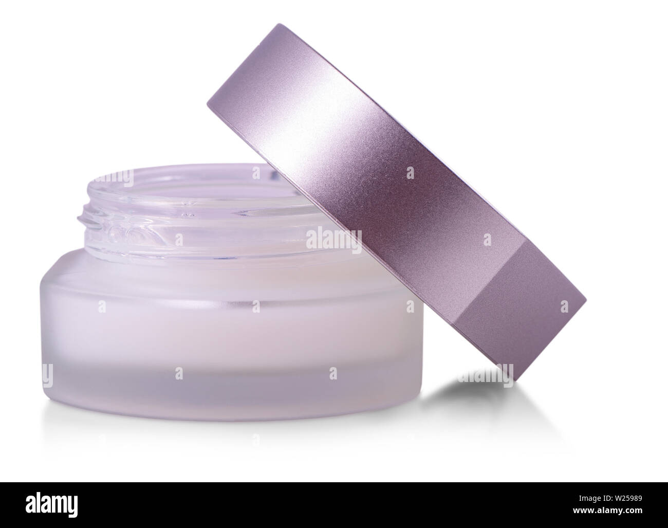 opened glass jar of beauty cream with cap isolated on white background ...
