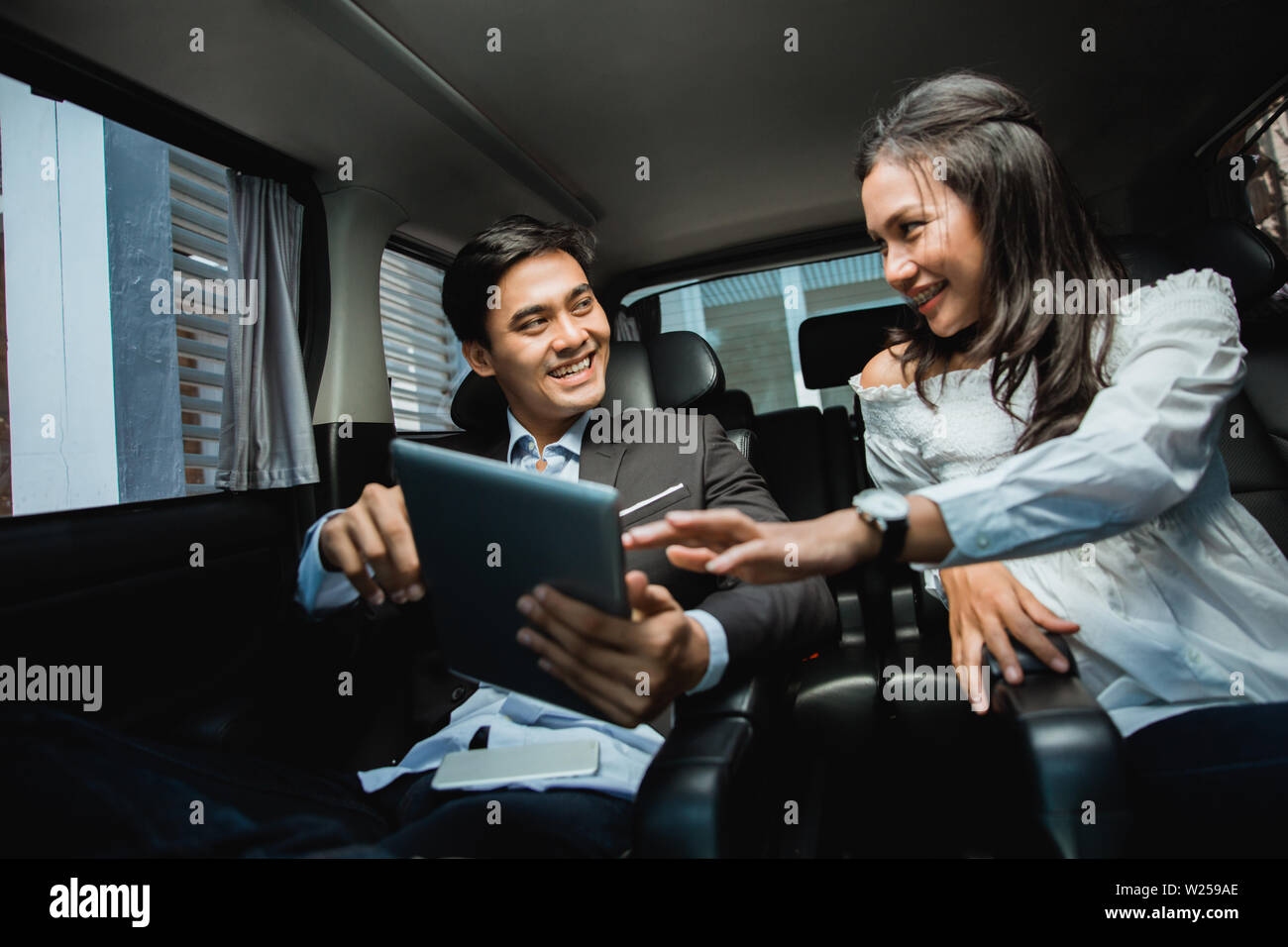 young business people meeting in the car. busy team discuss on ...
