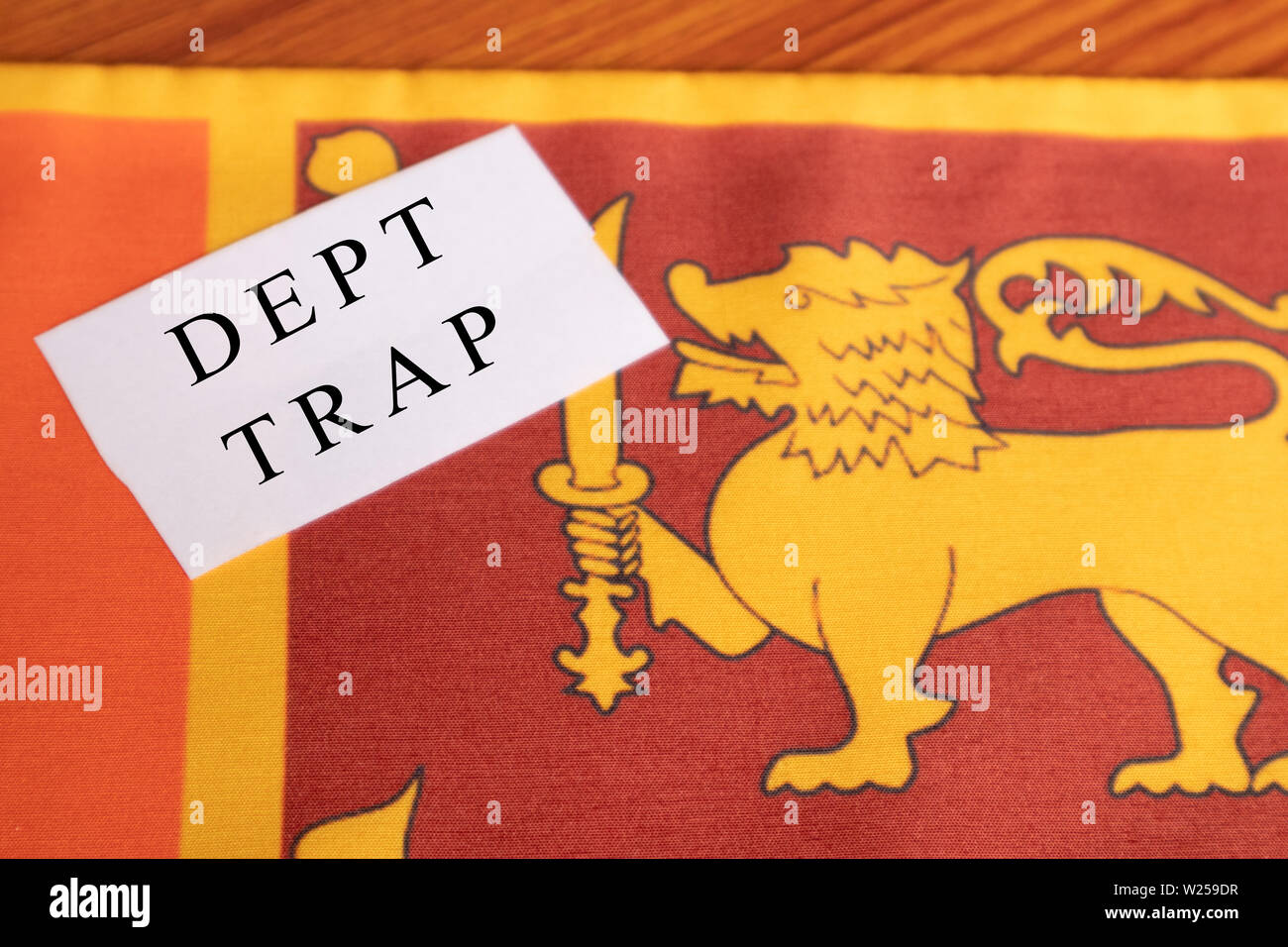 Concept of Dept trap printed on paper, Sri lankan flag as a background ...