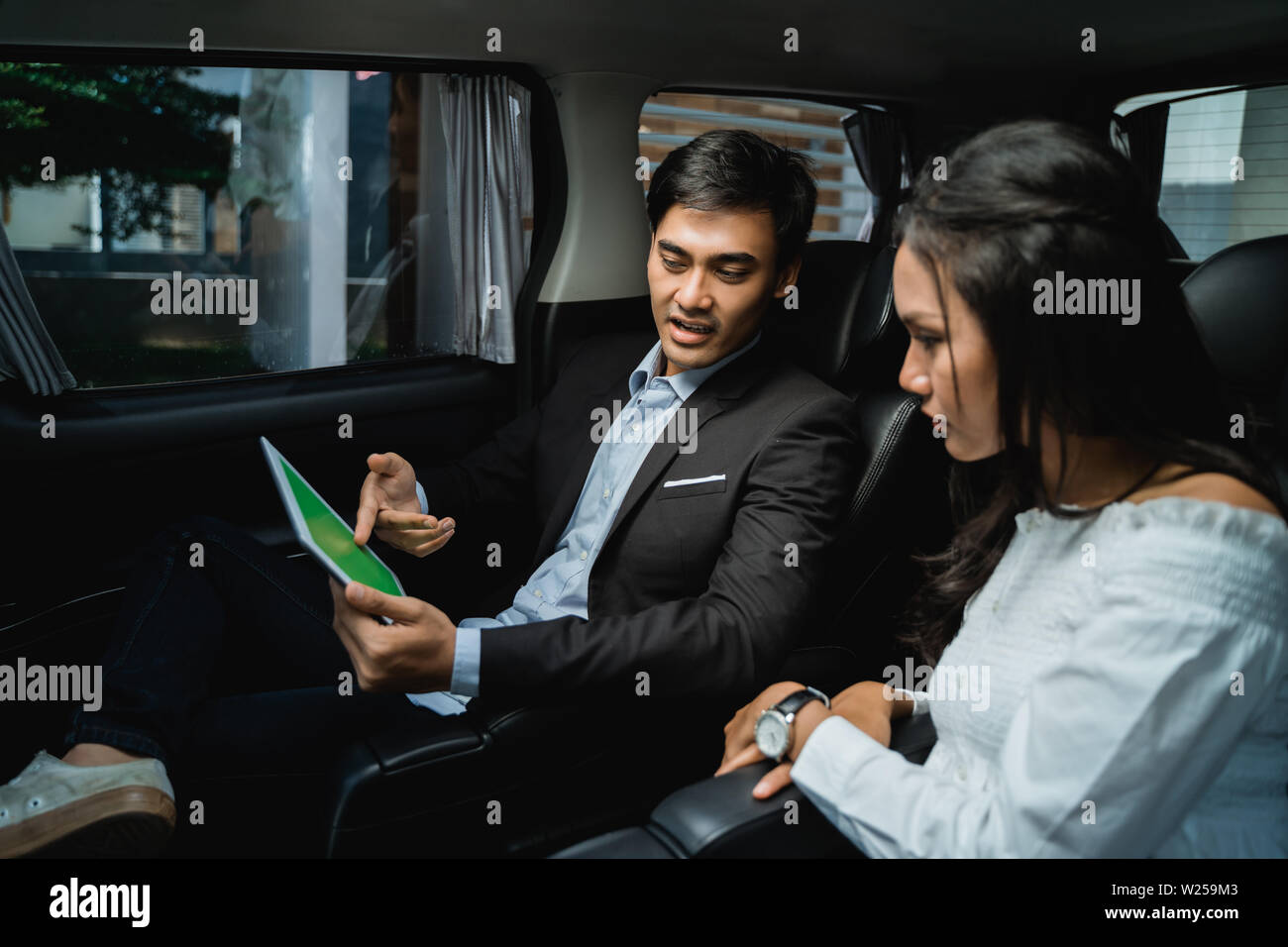 young business people meeting in the car. busy team discuss on ...