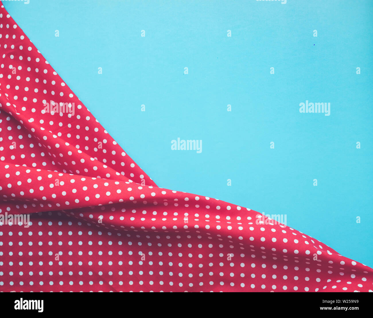 Dots red fabric cloth with blue background.For decoration key visual ...