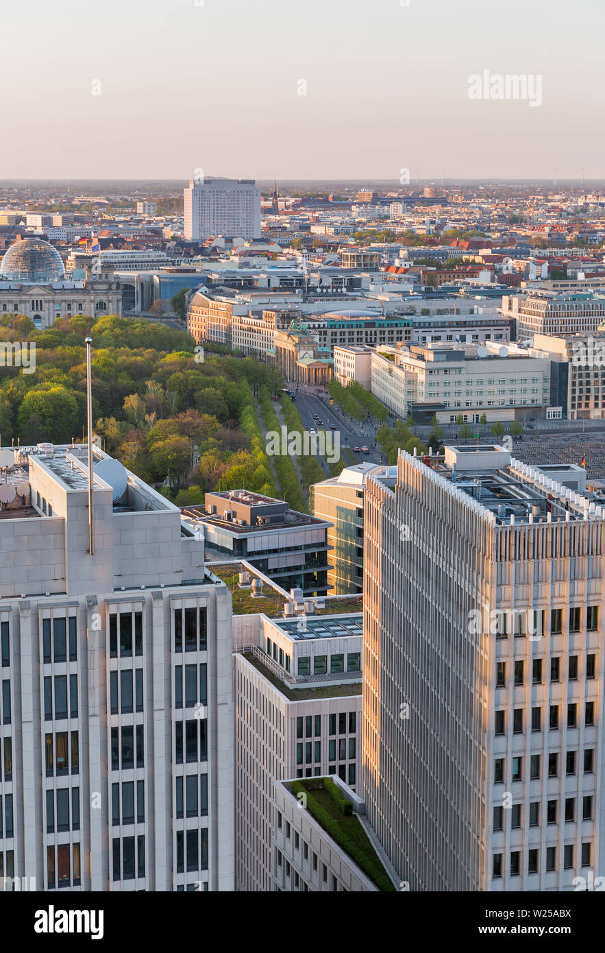 Aerial cityscape with Tiergarten park and Reichstag building at sunset ...