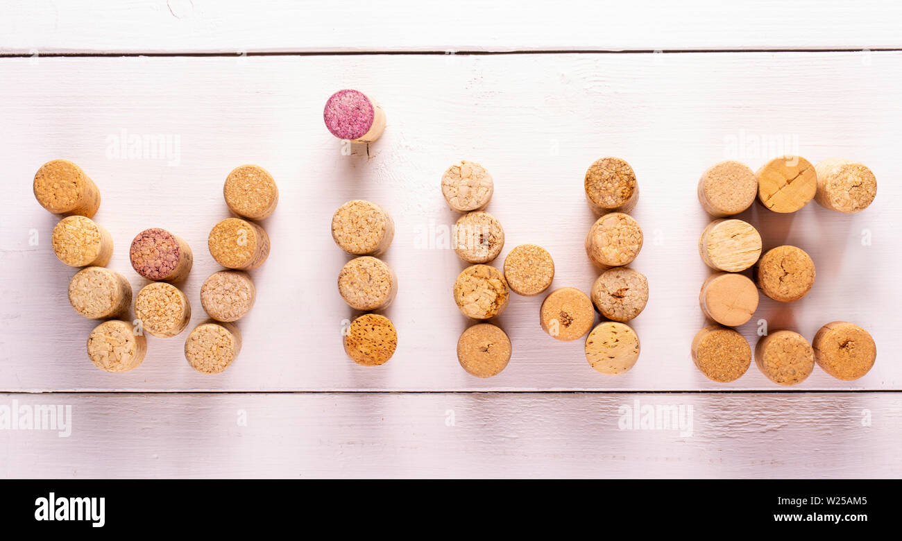 inscription wine corks on white wooden background Stock Photo - Alamy