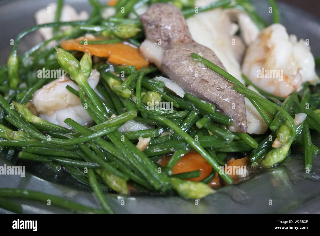 stir fried chives, Chinese cooking Stock Photo - Alamy
