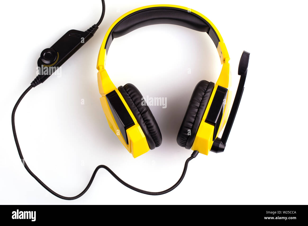Yellow headphones with a microphone isolated on white background Stock ...