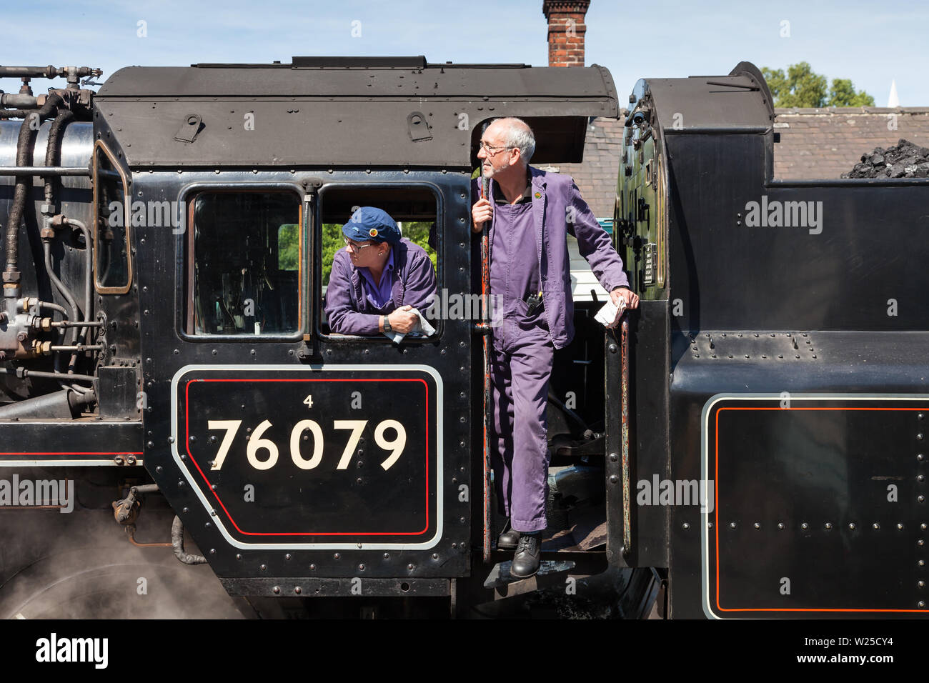 A close up of the driver and fireman on steam train 76079. The train ...