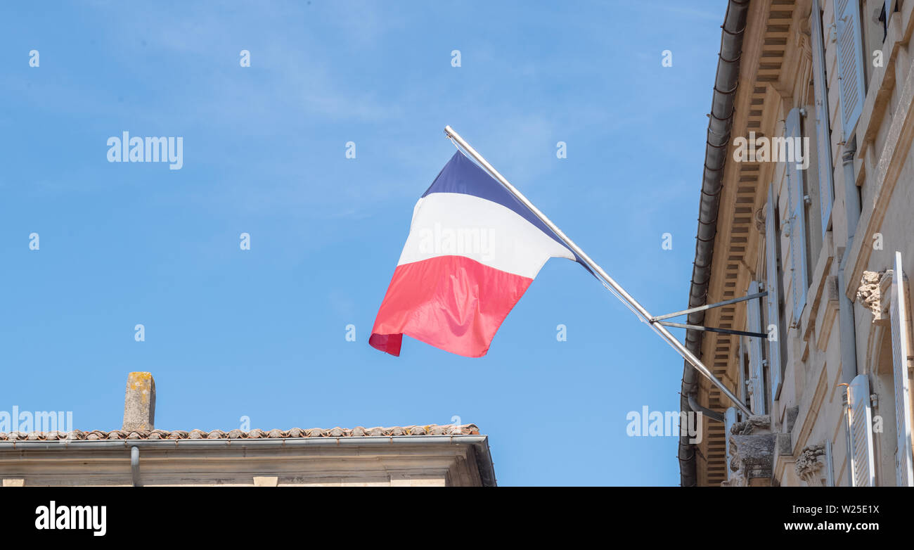 Tricolor flying on public building in Arles, Provence, France Stock ...