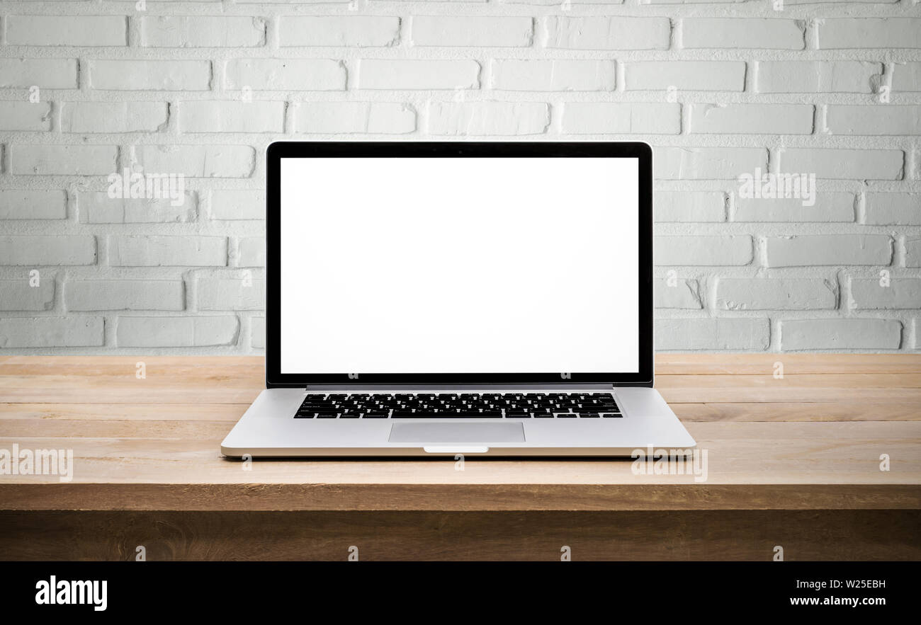 Modern computer,laptop with blank screen on wall brick backgrounds ...