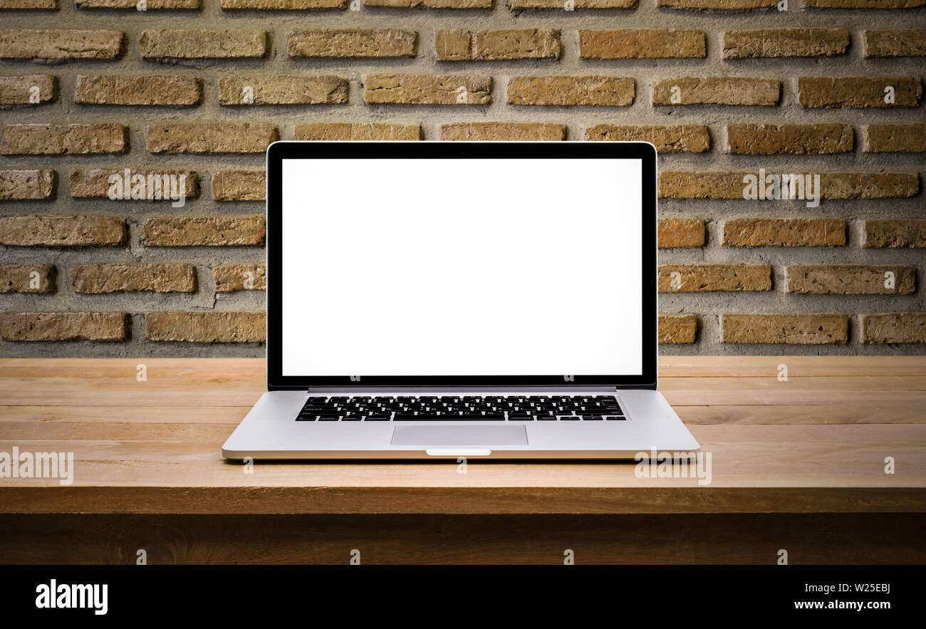 Modern computer,laptop with blank screen on wall brick backgrounds ...