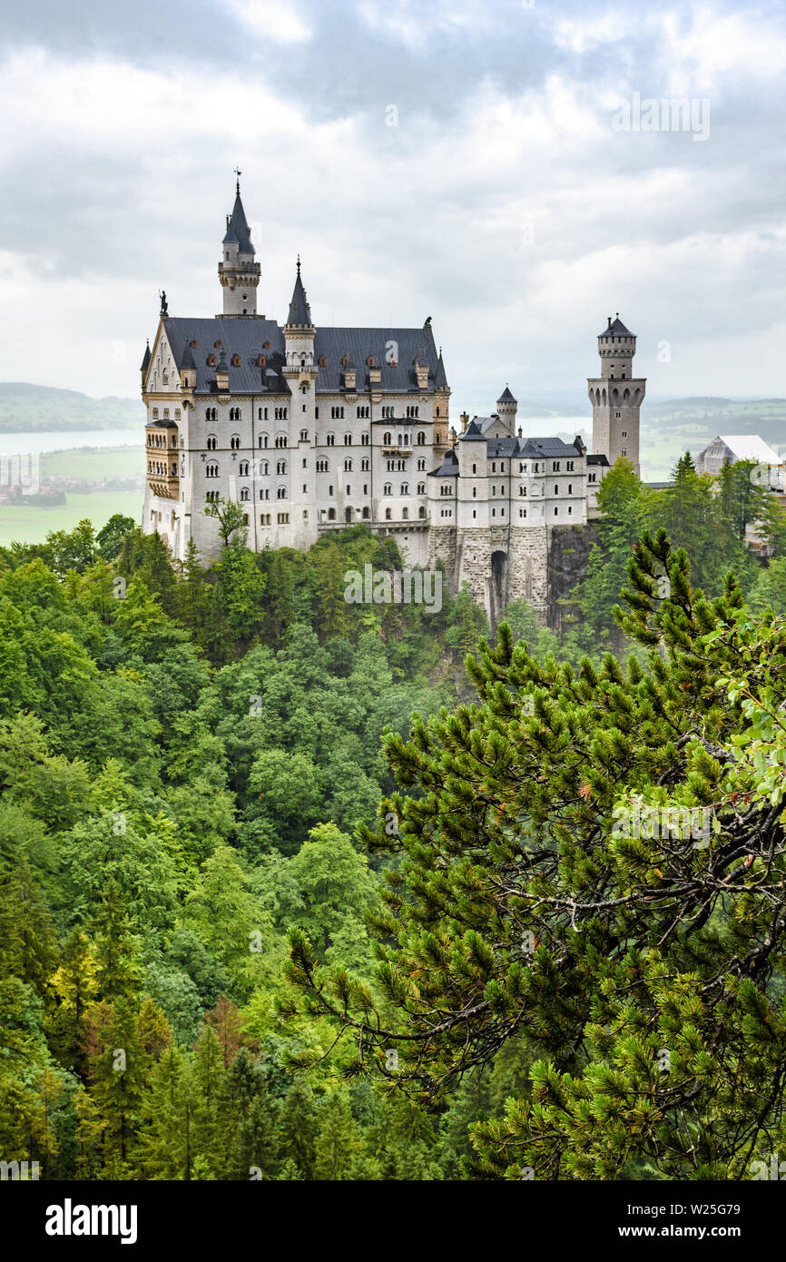 Royal castle on a wooded hill amid plains and thunderclouds and tree ...