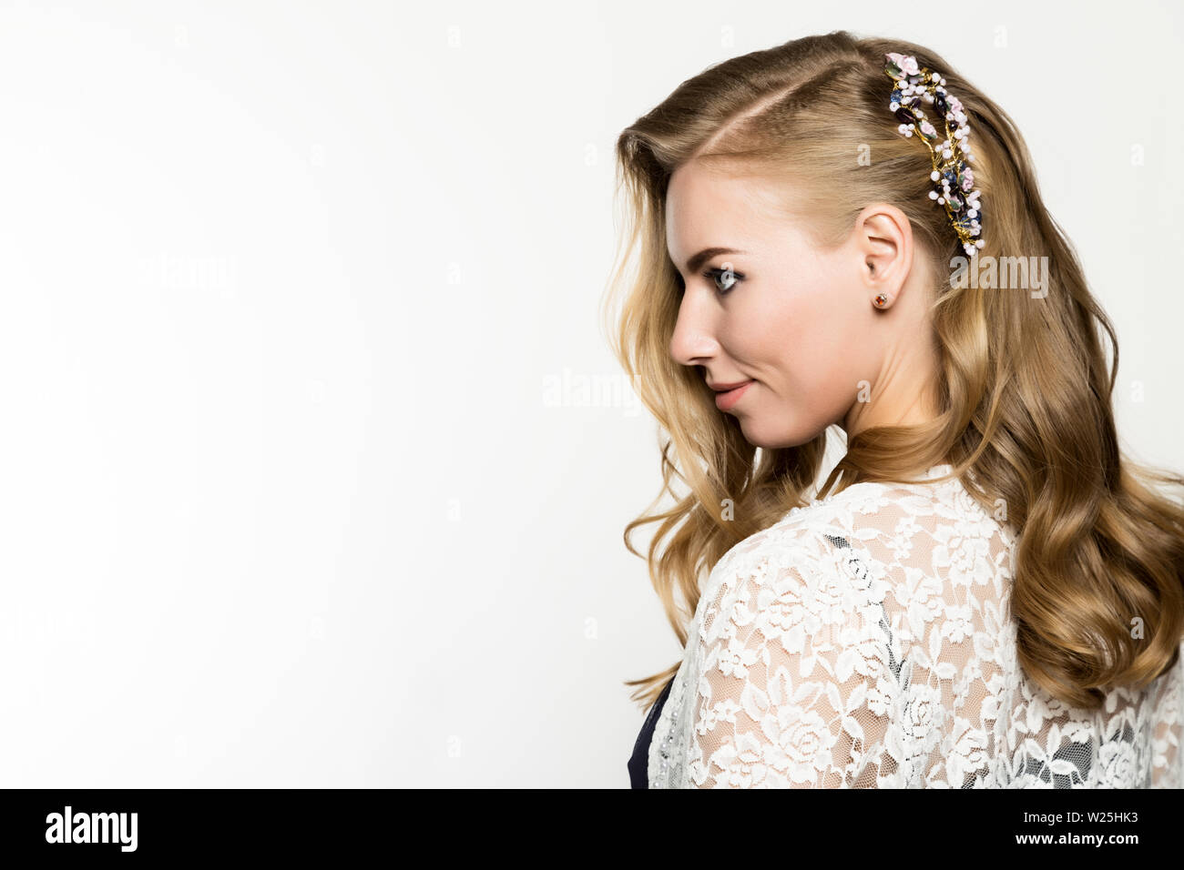 Beautiful young woman poses on a white background Stock Photo - Alamy