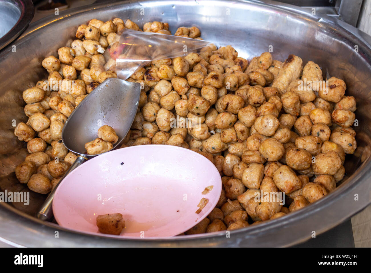 Fried fish balls exposed in a street food restaurant in Bangkok Stock ...