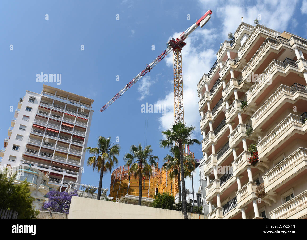 Building construction in Monaco. Construction crane Stock Photo - Alamy