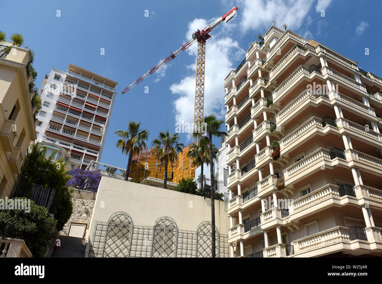 Building construction in Monaco. Construction crane Stock Photo - Alamy