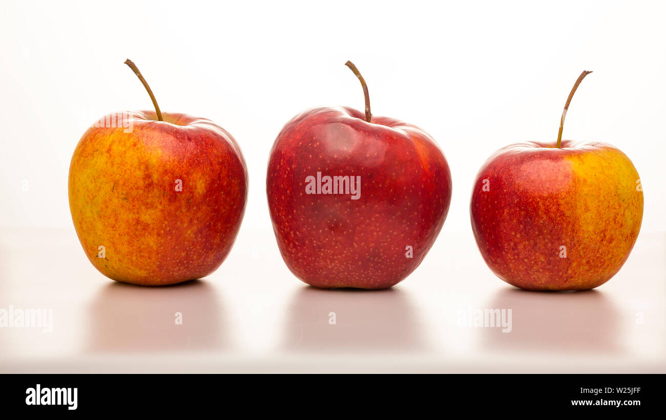 Three ripe apples isolated on white background Stock Photo - Alamy