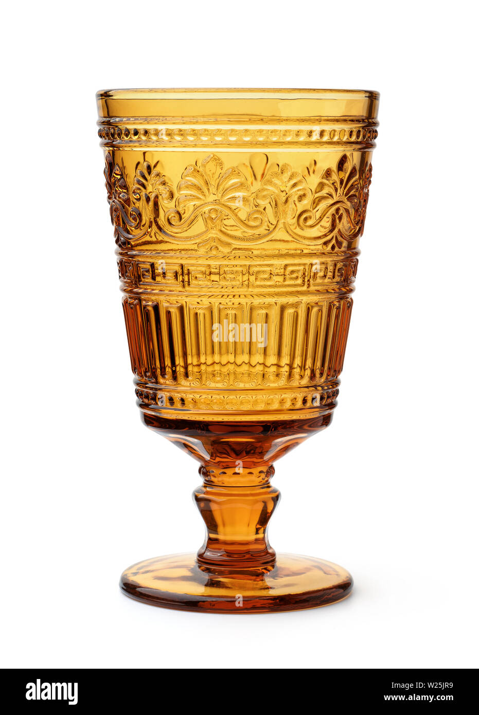 Front view of vintage amber pressed glass goblet isolated on white ...