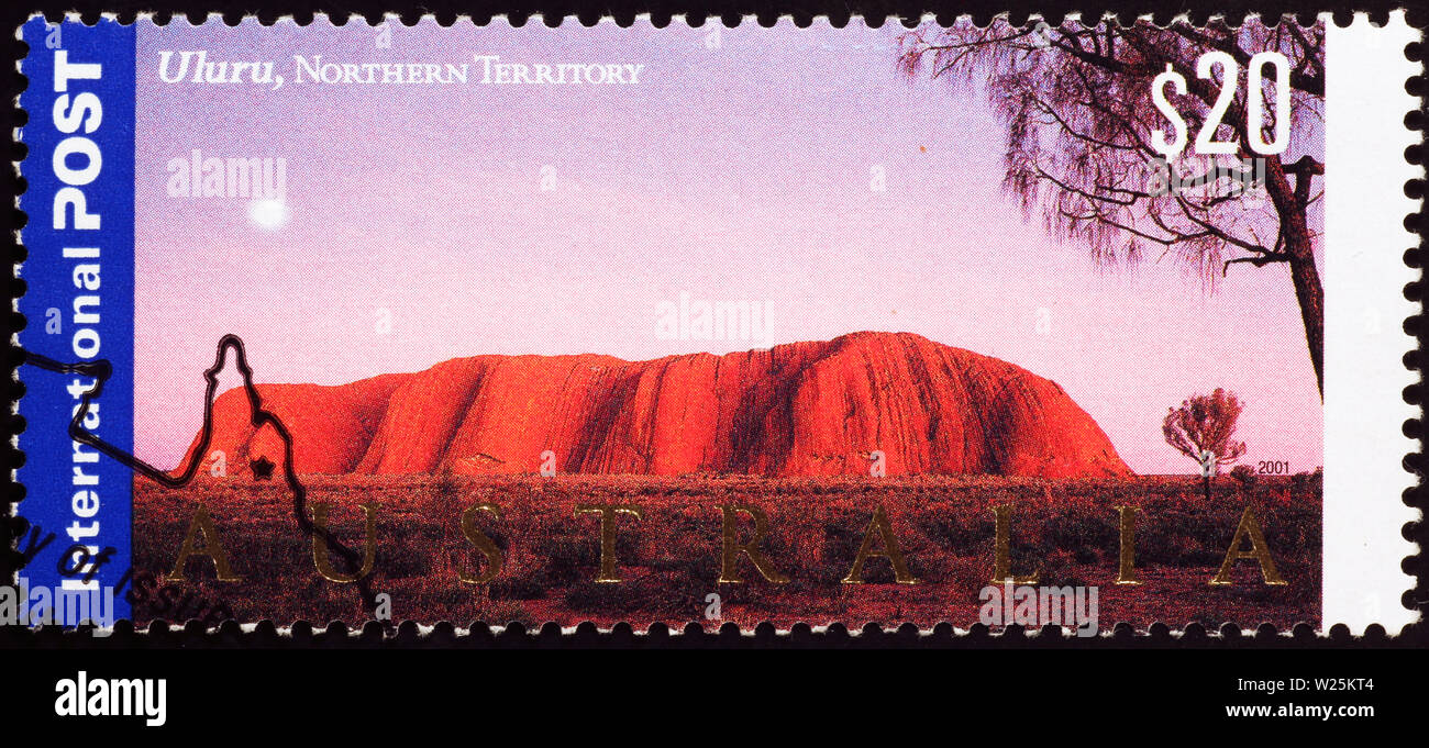 Ayers Rock at sunset on australian postage stamp Stock Photo - Alamy
