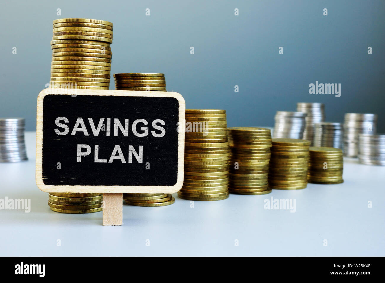 Savings plan and rise chart from coins Stock Photo - Alamy