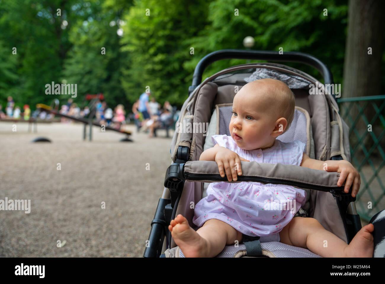 a small child on the playground in a pram Stock Photo - Alamy