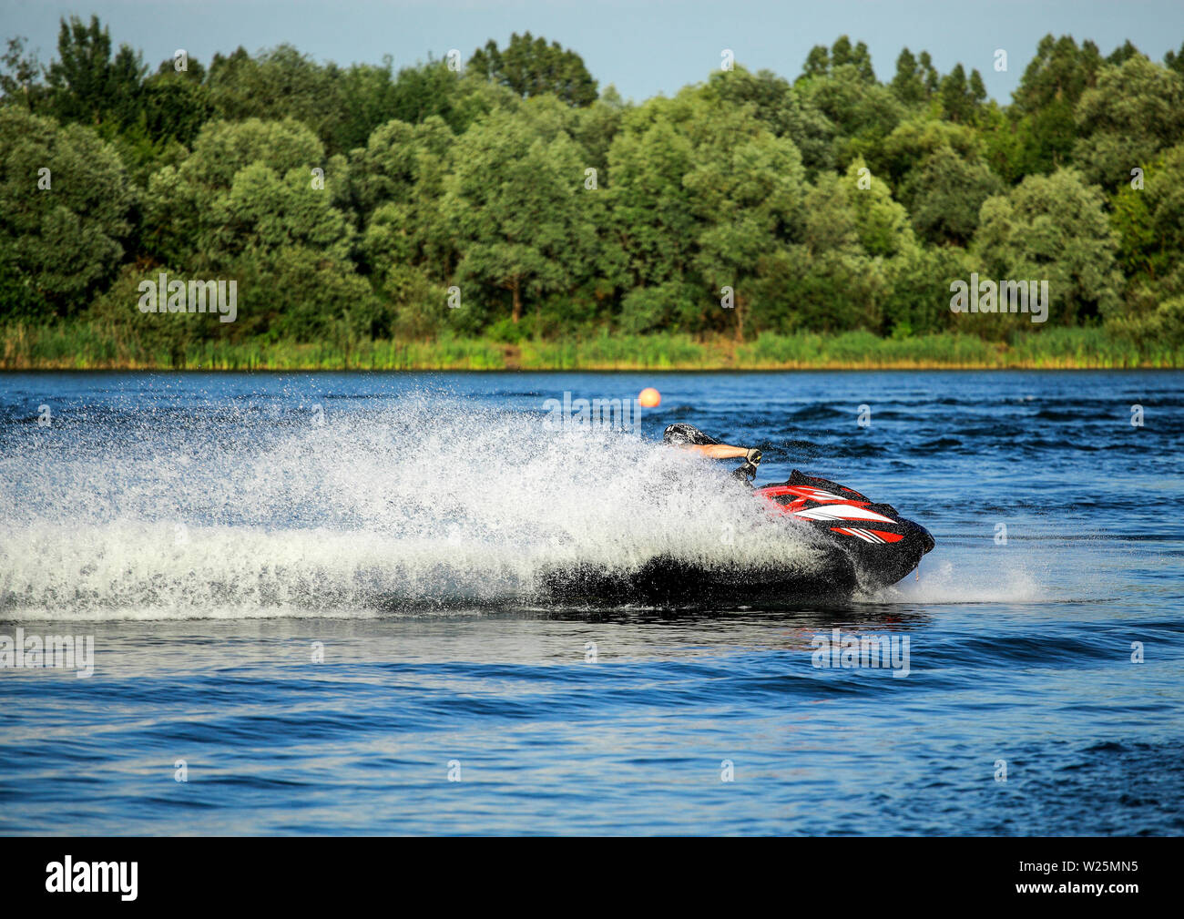 Competitions. Wave and spray from under the jet ski on the turn Stock ...